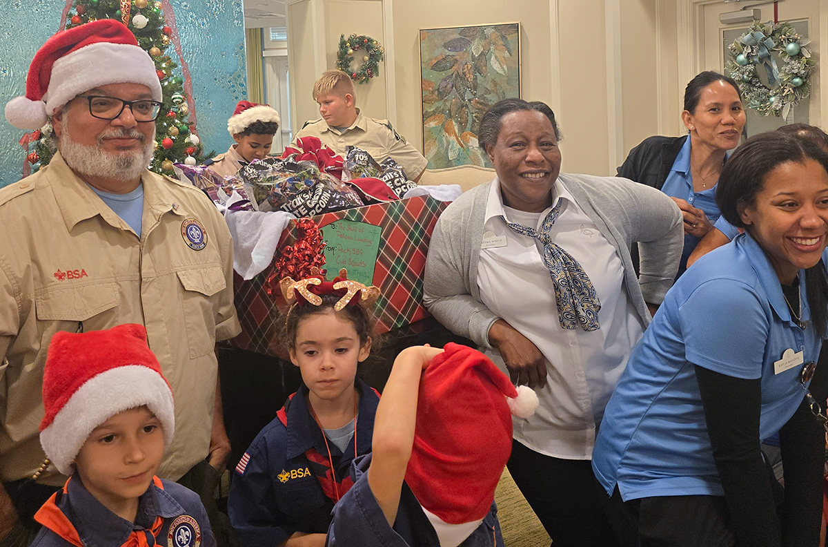 Cub Scouts spread holiday cheer with gifts, songs at Sebastian assisted ...